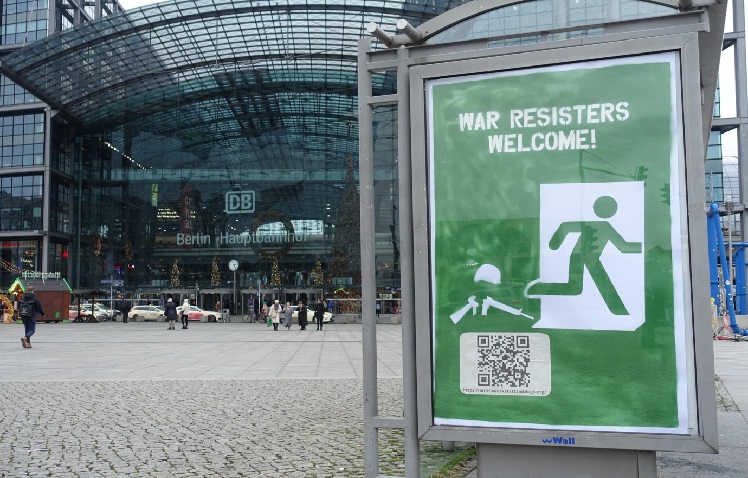 Berlin: Emergency exit posters demand asylum for conscientious ...